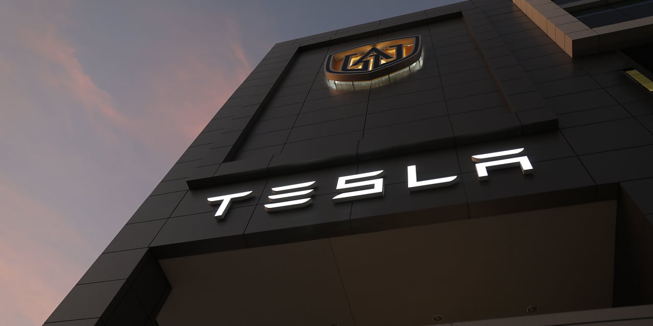 Tesla stock is giving back what it gained in the last minute before ...