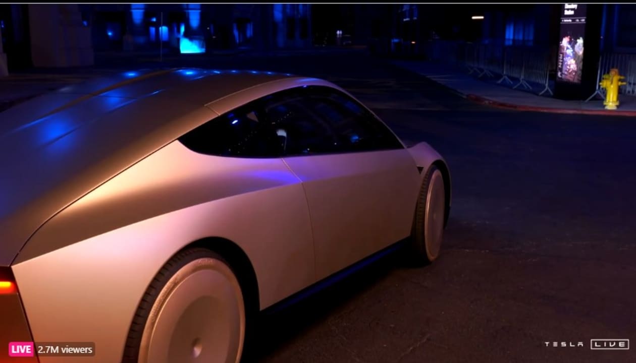 Tesla unveils its Cybercab robotaxi, with no steering wheel and under ...