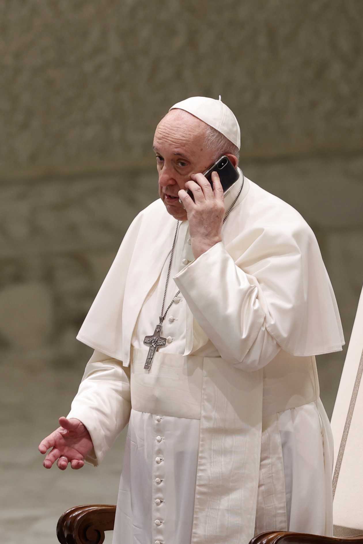 Pope Francis takes an urgent phone call during his weekly general ...
