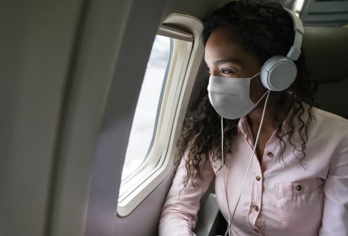 Face masks travelers should wear on the airplane to protect against ...