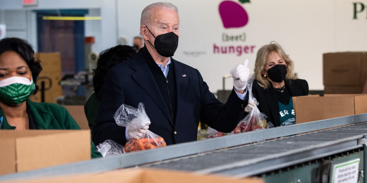 Bidens pack boxes at food bank to mark Martin Luther King Jr. Day ...