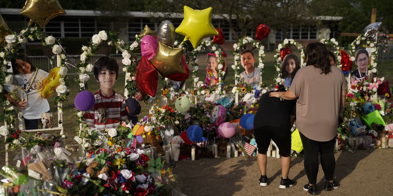 Small casket, overflow crowd of mourners as first funerals start in ...