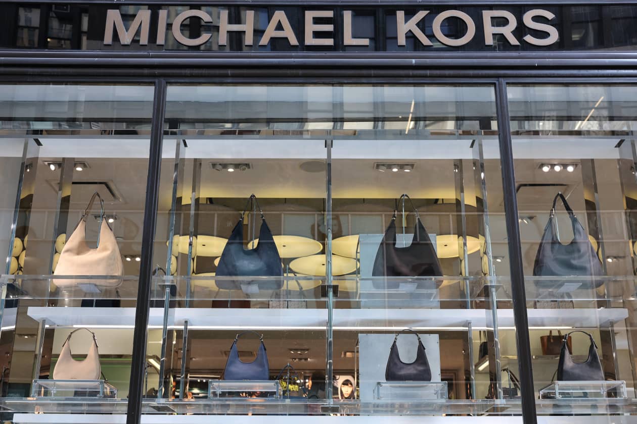 Stock of Michael Kors owner Capri dives 45% after judge blocks merger ...