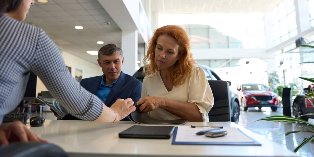 Average new car price held steady in March, but pre-tariff inventory is ...