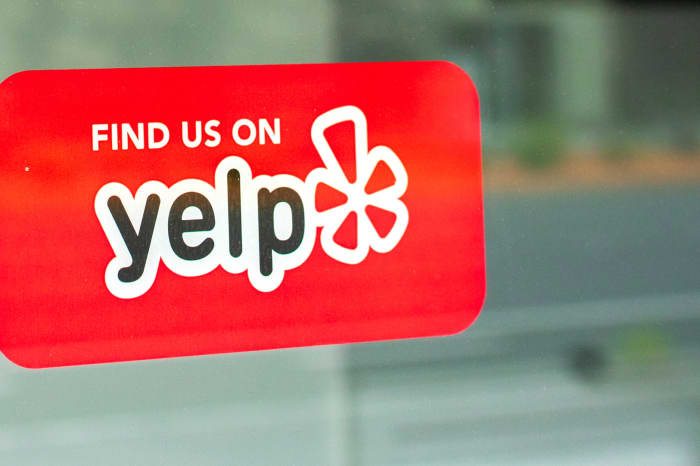 Yelp posts strong year, but weak guidance sends its stock sliding ...