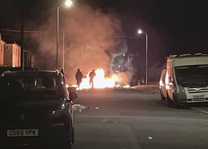 Police facing large-scale disorder in Welsh capital as cars set on fire ...