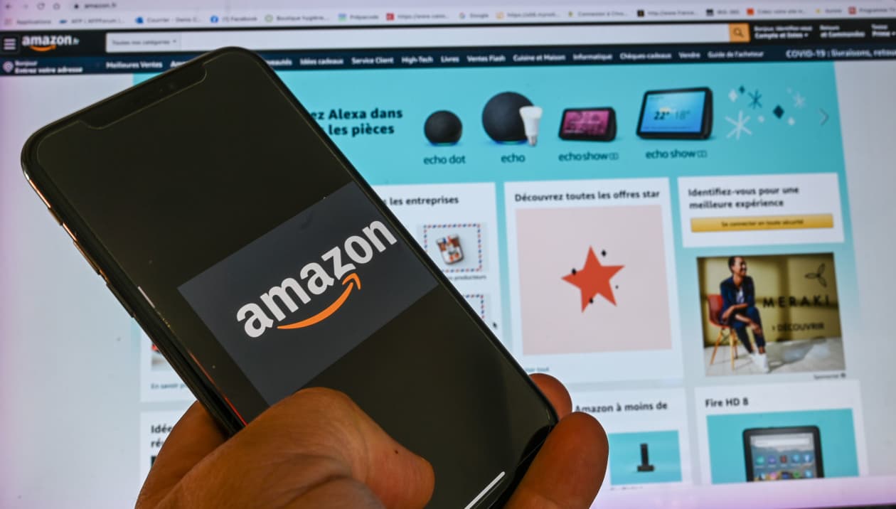 Amazon and JPMorgan stocks fall, Rivian and DraftKings shares rally ...